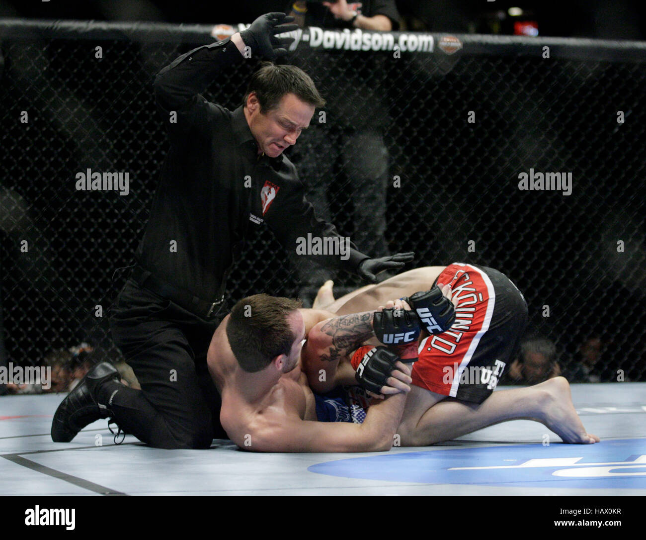 Cole Miller, blue shorts, fights Dan Lauzon, red and black shorts ...