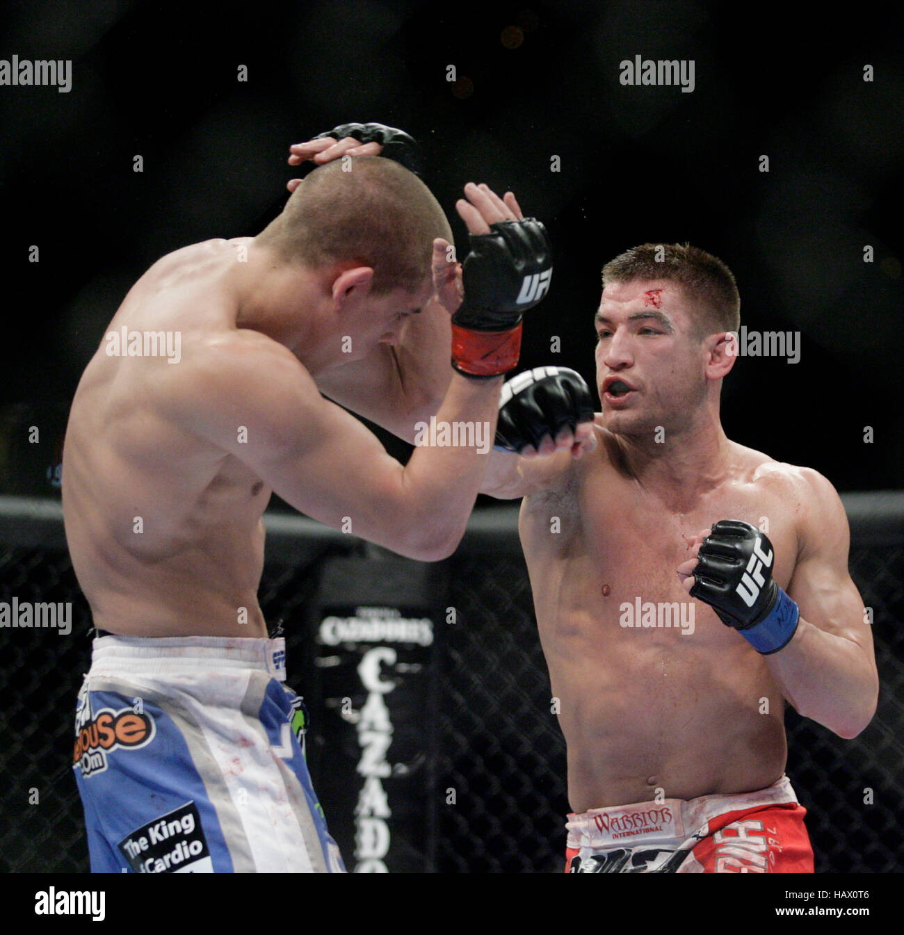 Sam Stout, right, fights Joe Lauzon during UFC 108 at the MGM Grand ...
