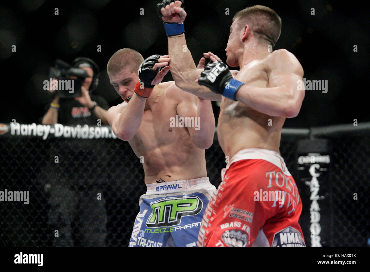 Sam Stout, right, fights Joe Lauzon during UFC 108 at the MGM Grand ...