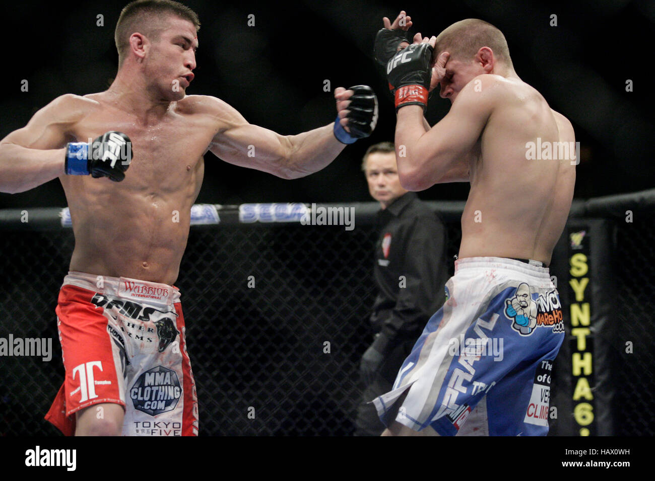 Sam Stout, left, fights Joe Lauzon during UFC 108 at the MGM Grand ...