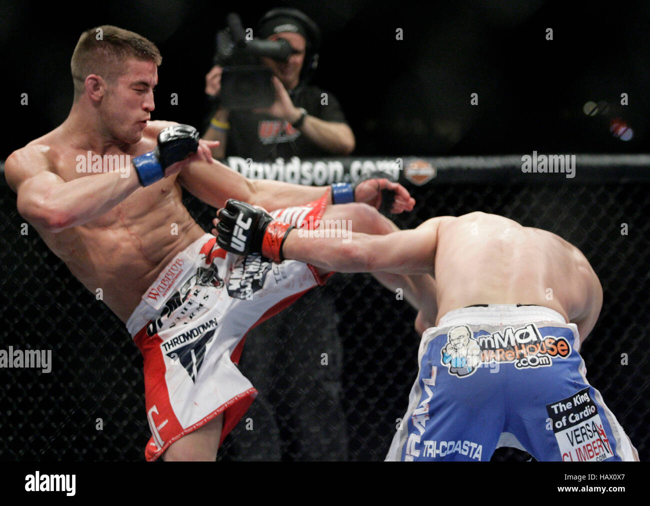 Sam Stout, left, fights Joe Lauzon during UFC 108 at the MGM Grand ...