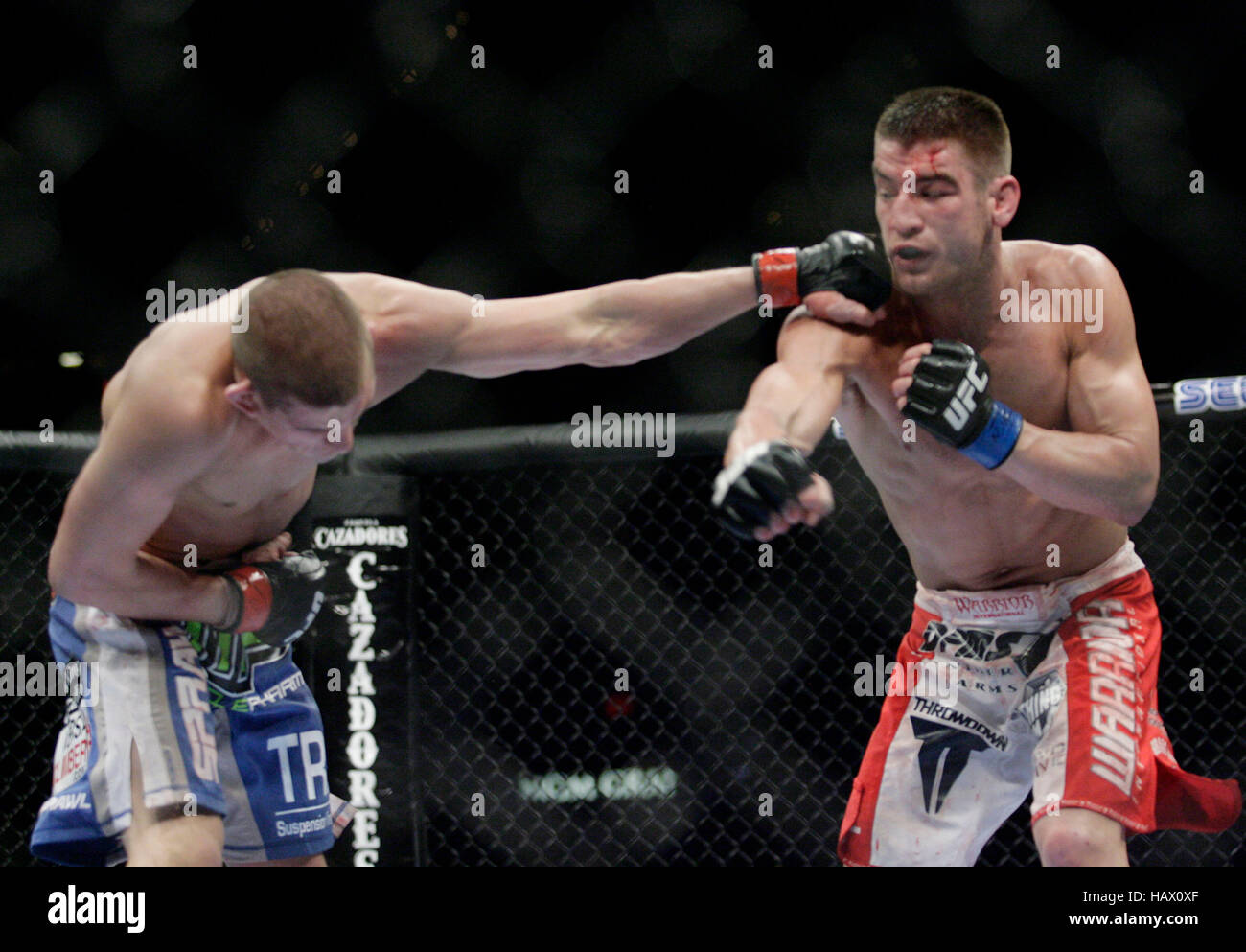 Sam Stout, right, fights Joe Lauzon during UFC 108 at the MGM Grand ...