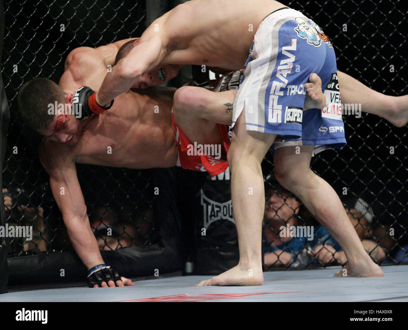 Sam Stout, left, fights Joe Lauzon during UFC 108 at the MGM Grand ...