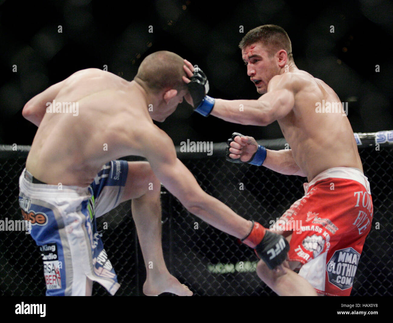 Sam Stout, right, fights Joe Lauzon during UFC 108 at the MGM Grand ...