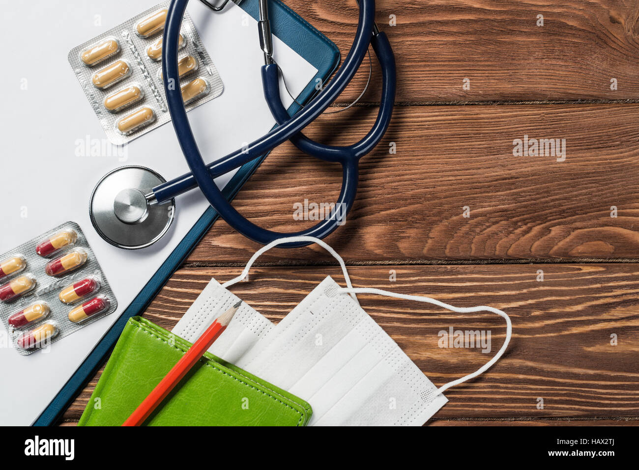 Desk of doctor with medicine things Stock Photo - Alamy