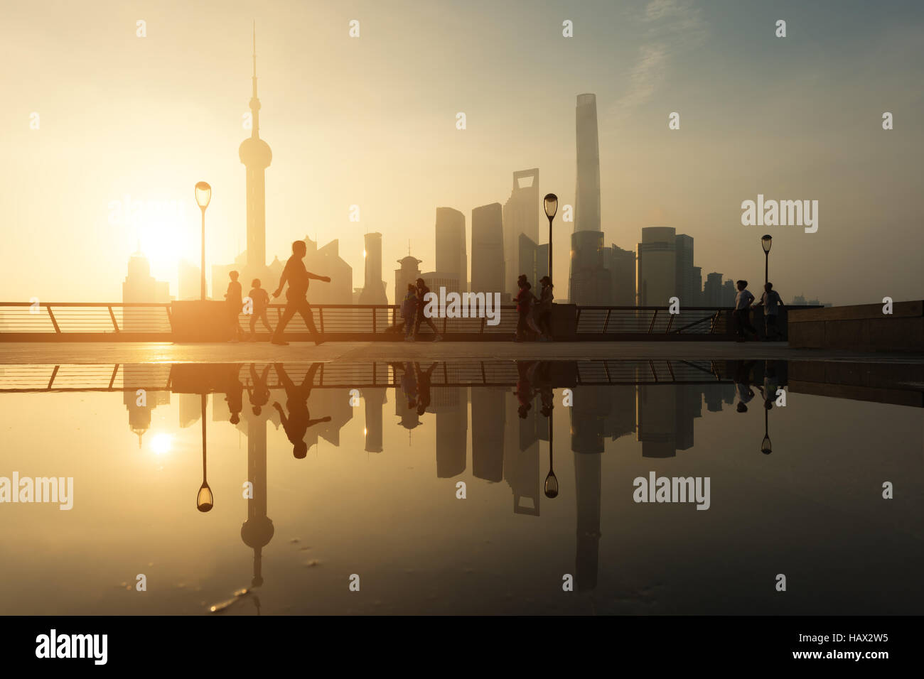 People running in morning at Huangpu River riverside with Shanghai ...