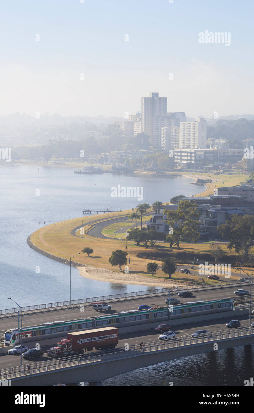A train and traffic on the Mitchell Freeway crossing over Narrows ...