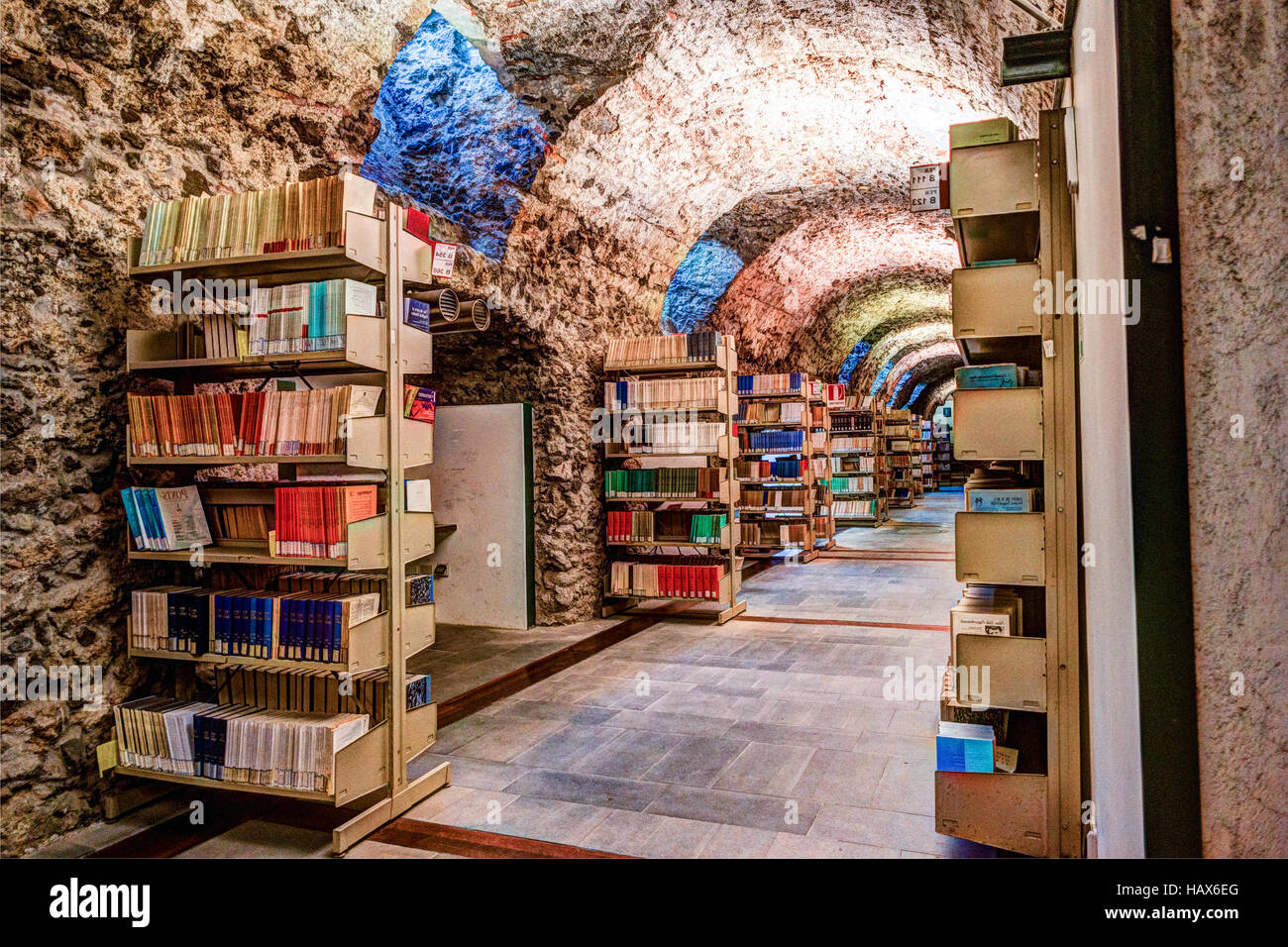 library setting with books and reading material Stock Photo - Alamy