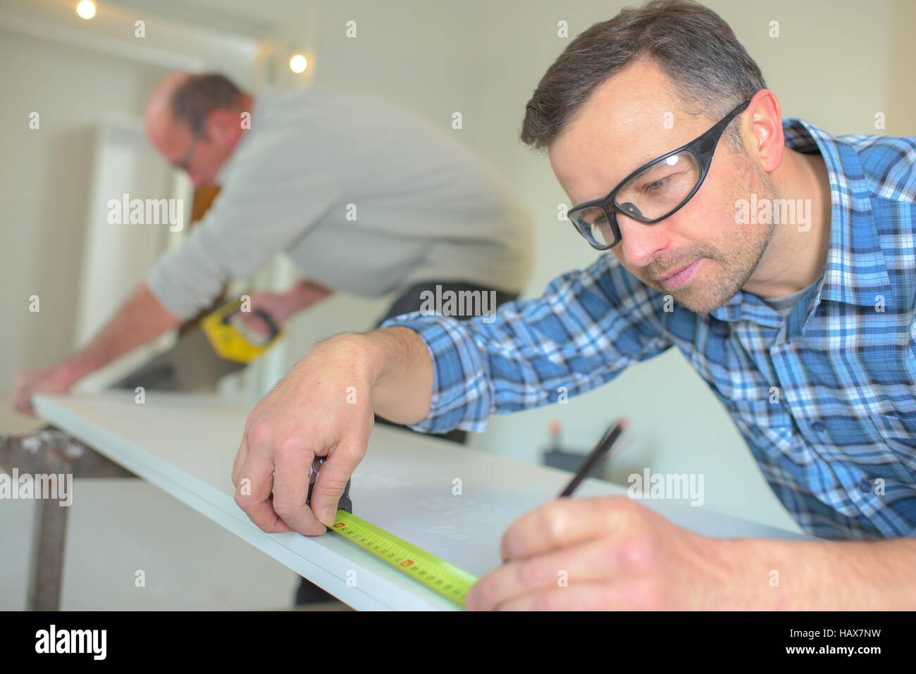 Self retracting metal tape measure hi-res stock photography and images ...