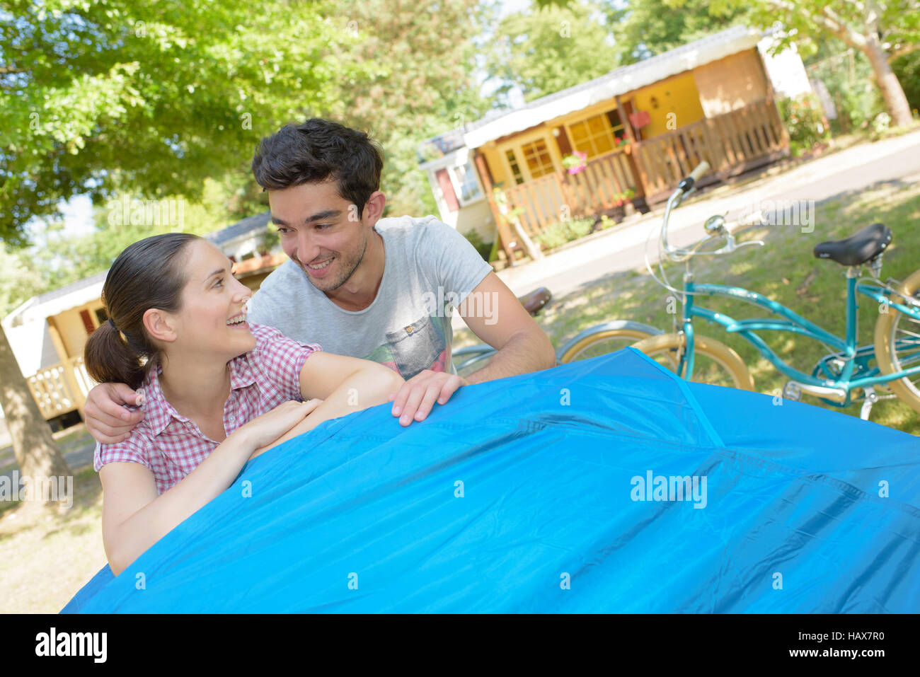 couple resting under a shade Stock Photo - Alamy
