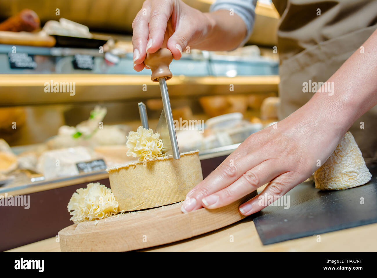 man cutting cheese Stock Photo - Alamy