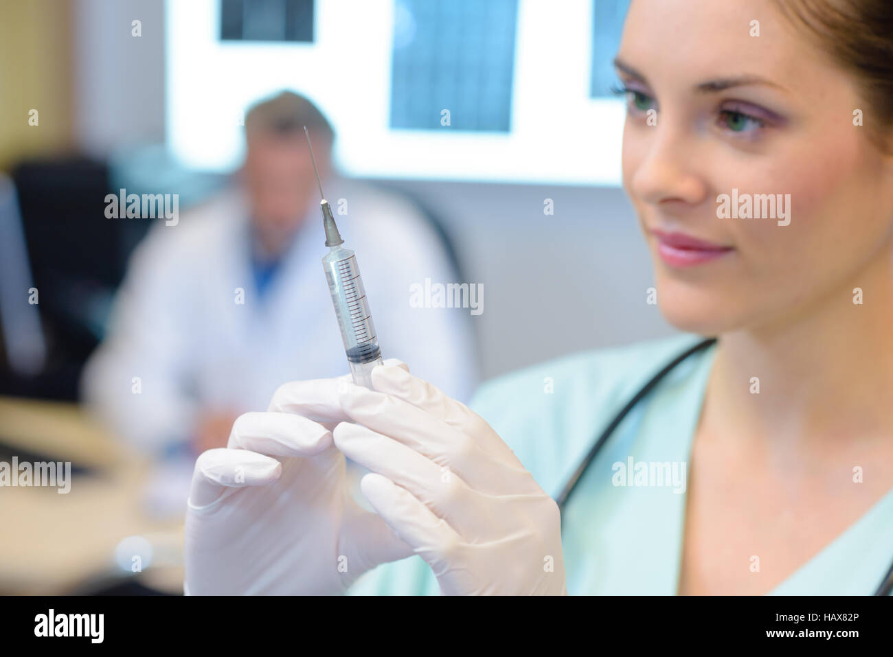 Closeup of nurse preparing syringe Stock Photo - Alamy