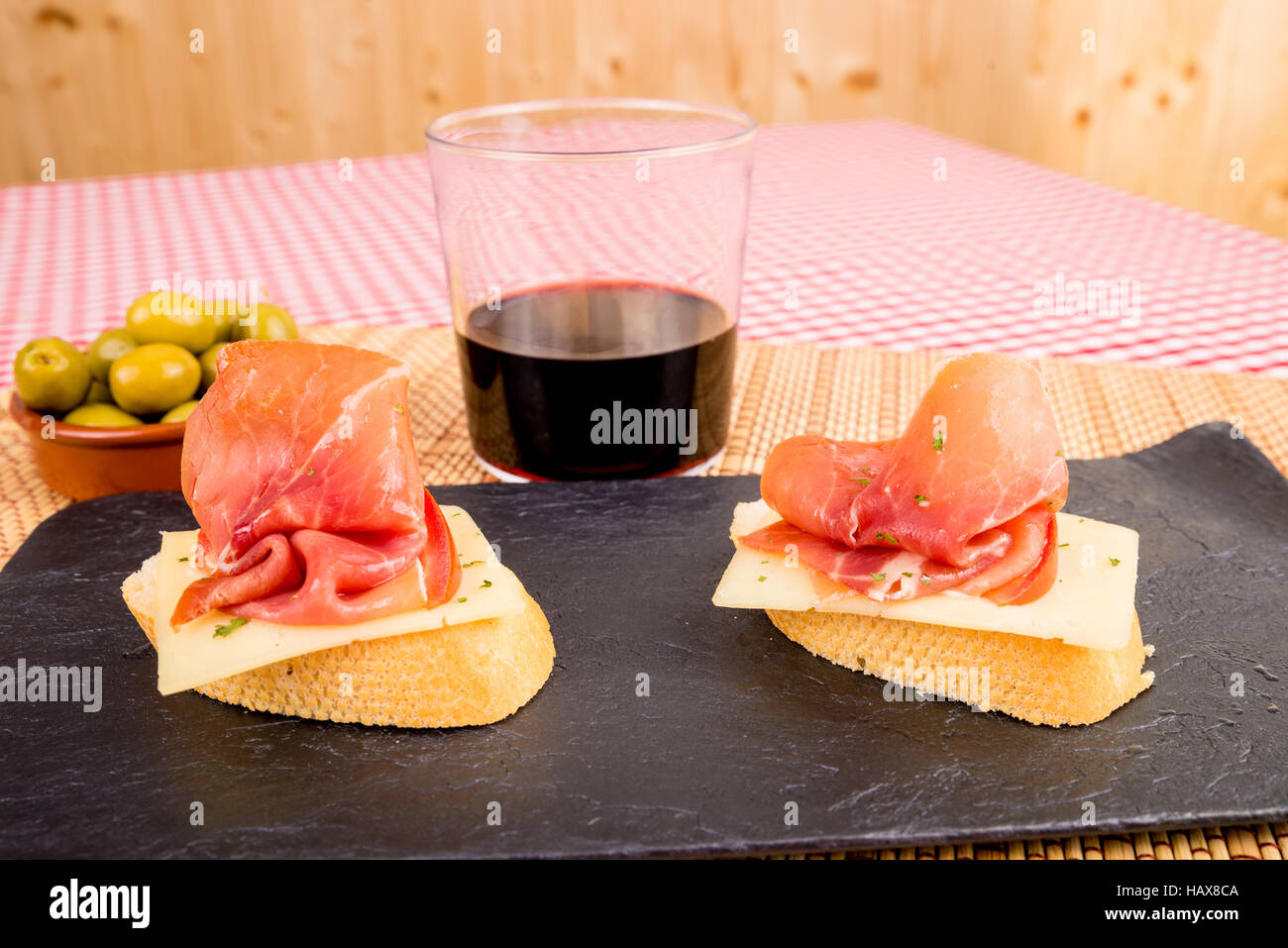 Traditional Spanish pincho style serrano ham tapa Stock Photo - Alamy