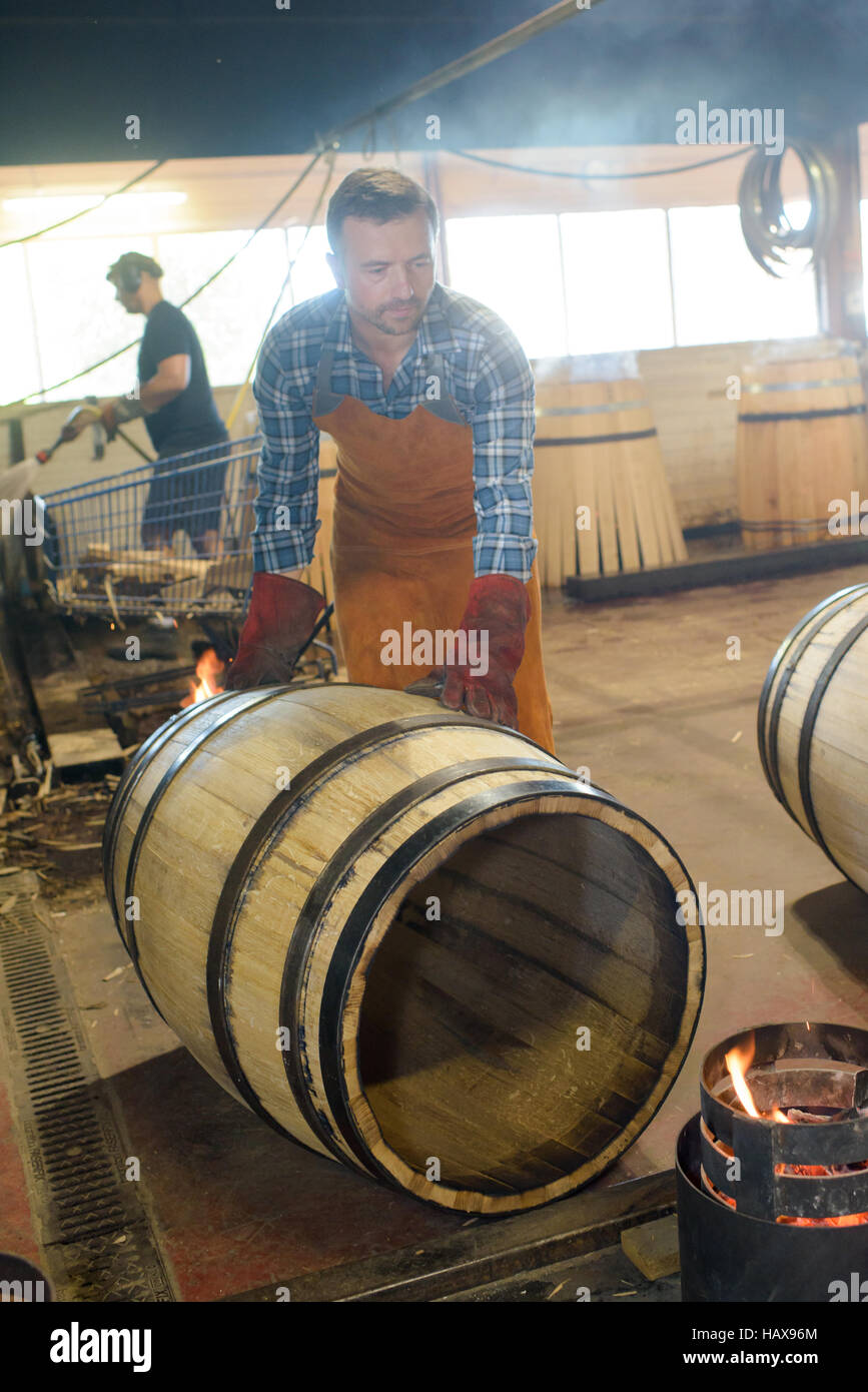 wood barrels production cooper using hammer and tools in workshop Stock ...