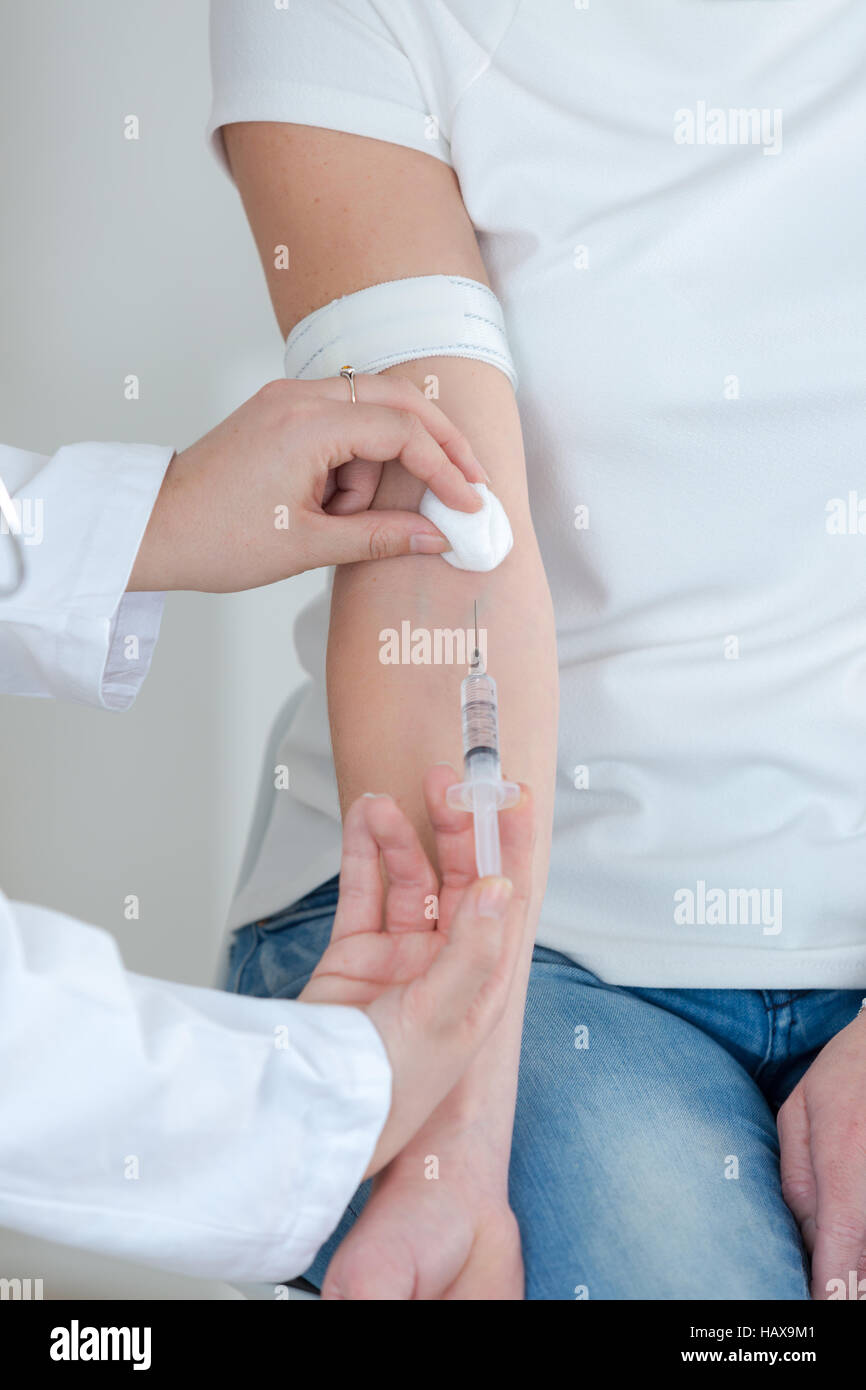 nurse do an inoculation the young woman Stock Photo - Alamy