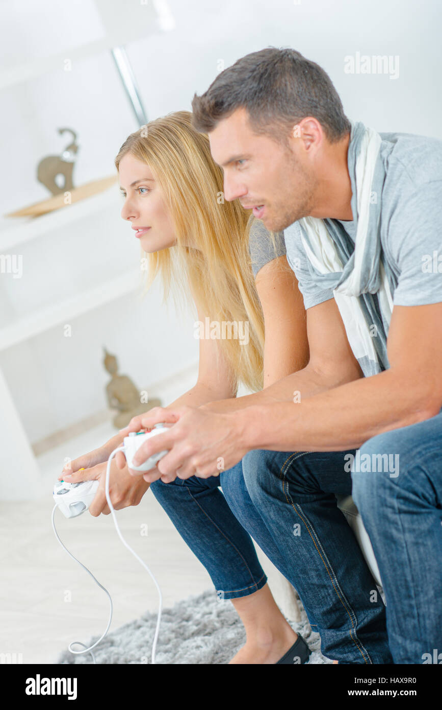 Couple in profile playing computer game Stock Photo - Alamy