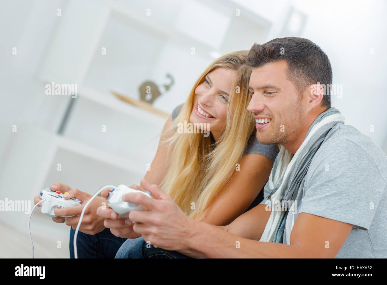 Young couple playing video games Stock Photo - Alamy