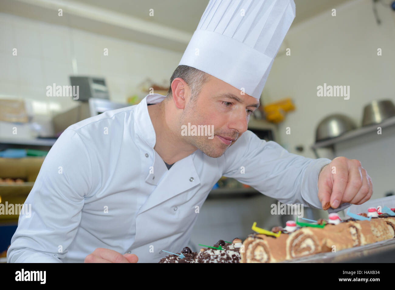 pastry chef holding delicious looking cakes and pastries Stock Photo ...
