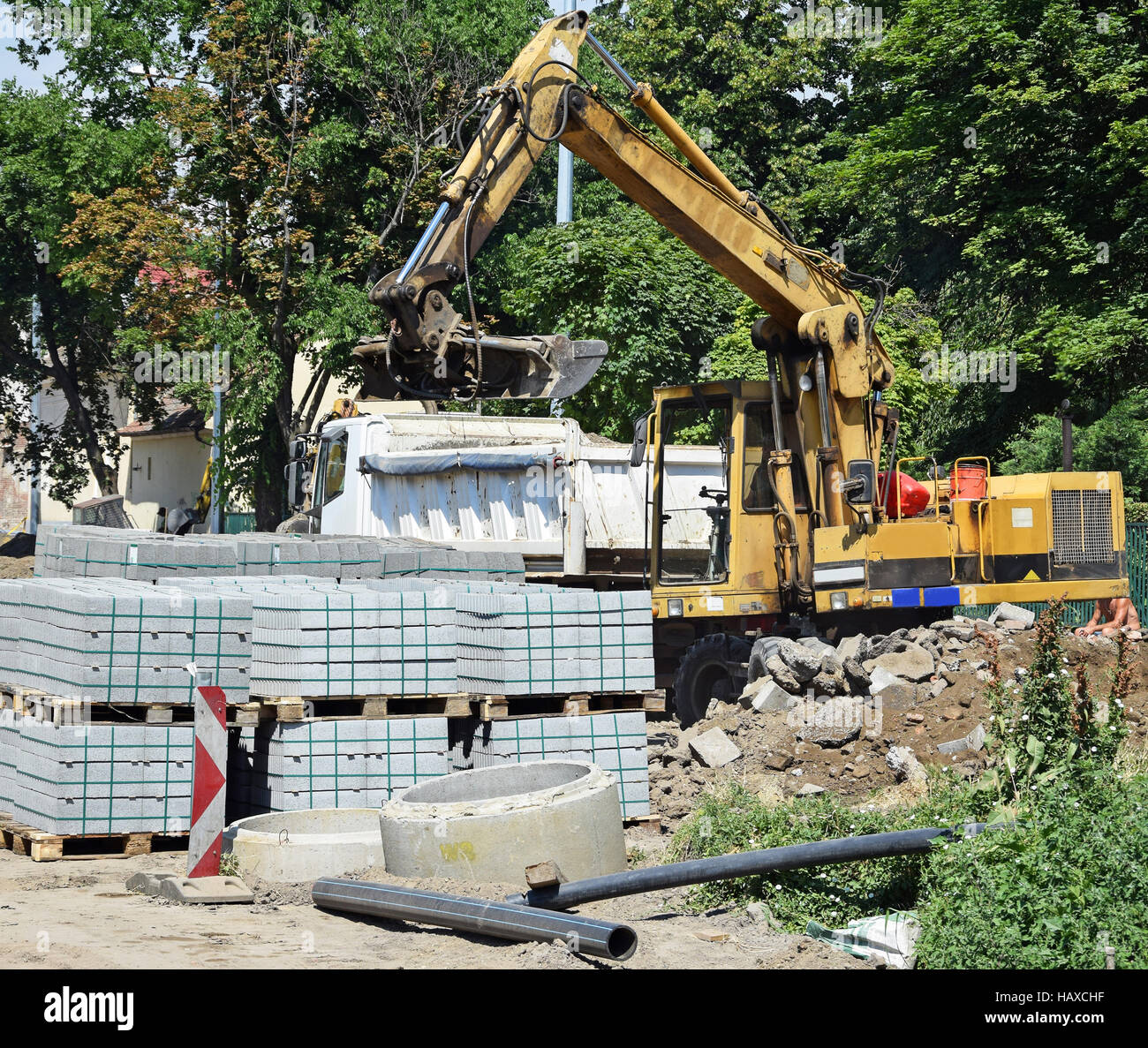 Road building red excavator hi-res stock photography and images - Alamy