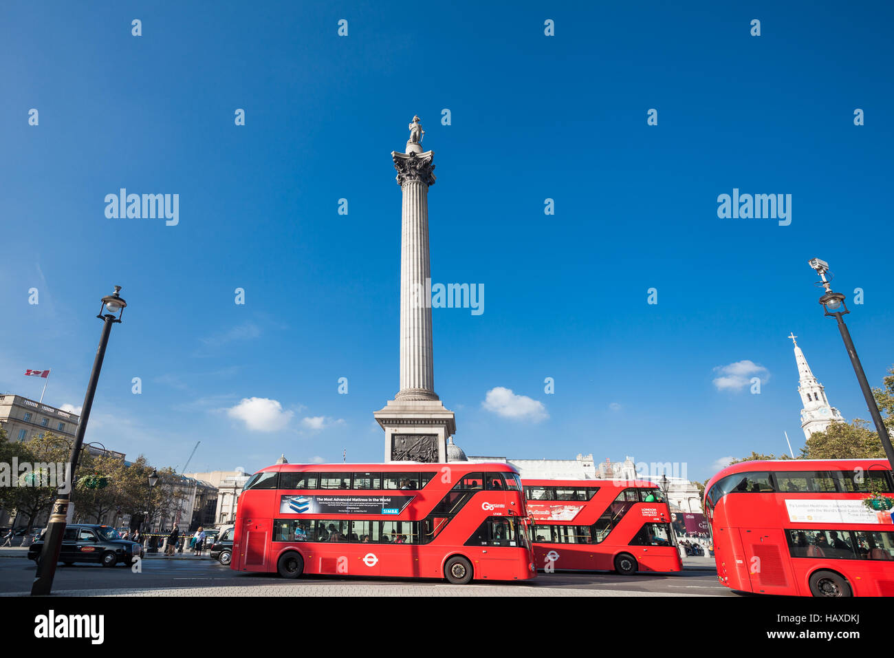London red traditional buses in Trafalgar Square in front of Napoleon ...