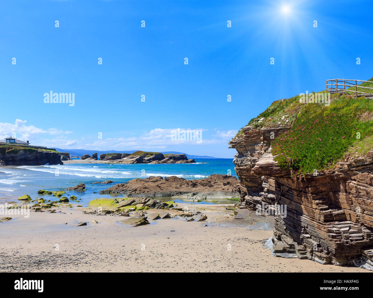 House on cliff and summer Atlantic sunshiny sandy beach Los Castros ...