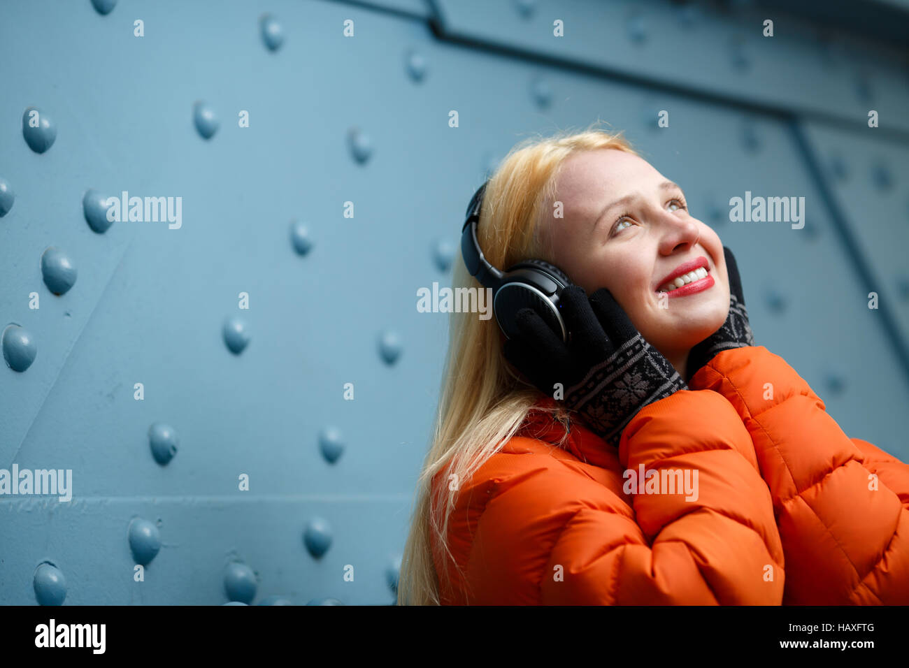 Girl having fun listening music Stock Photo - Alamy