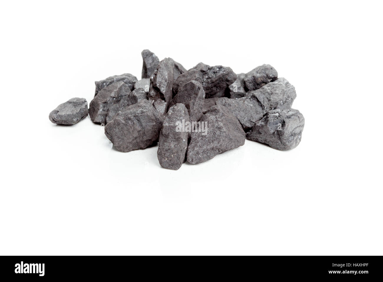 Coal stack isolated on white background Stock Photo - Alamy