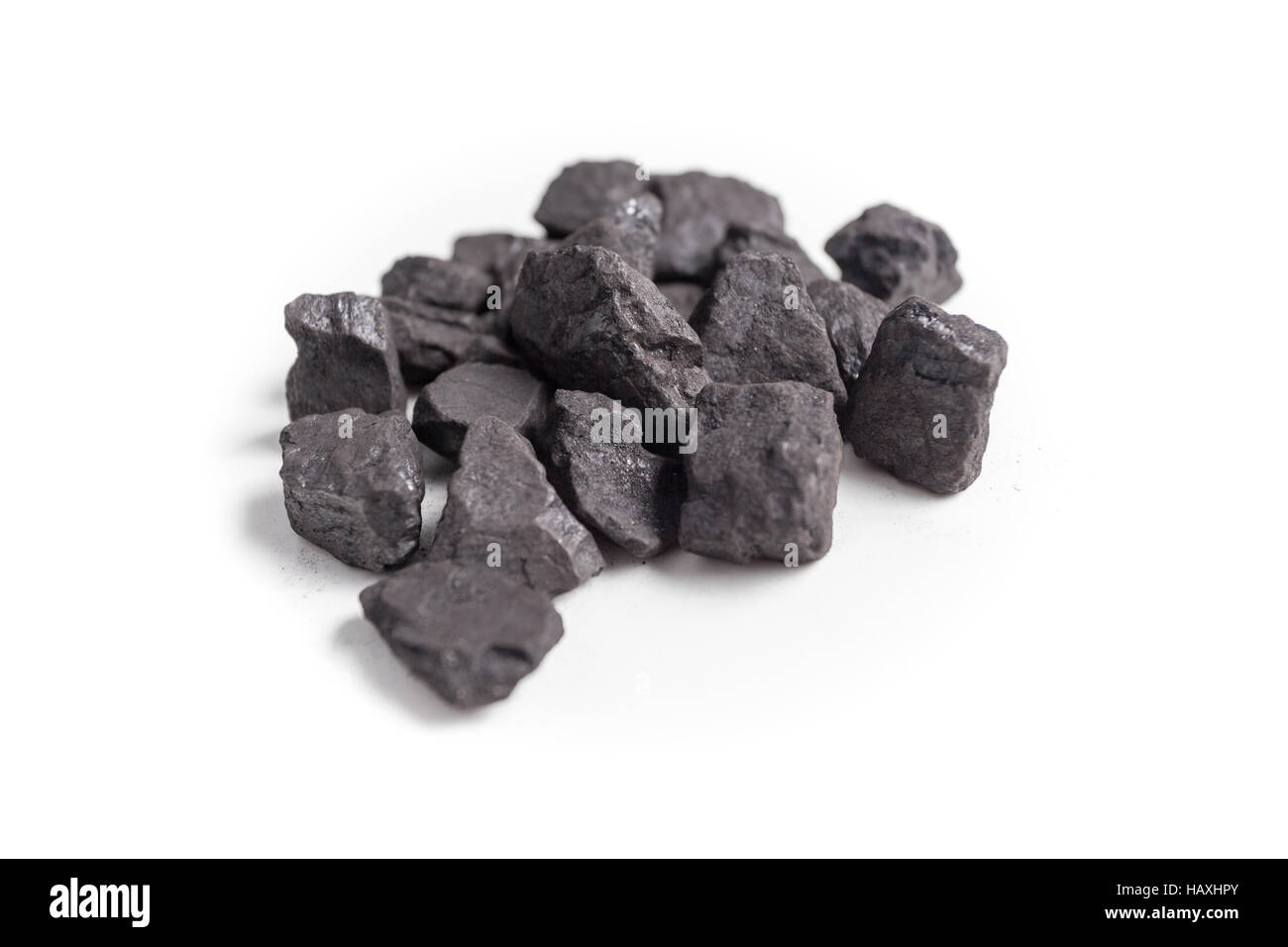 Coal stack isolated on white background Stock Photo - Alamy