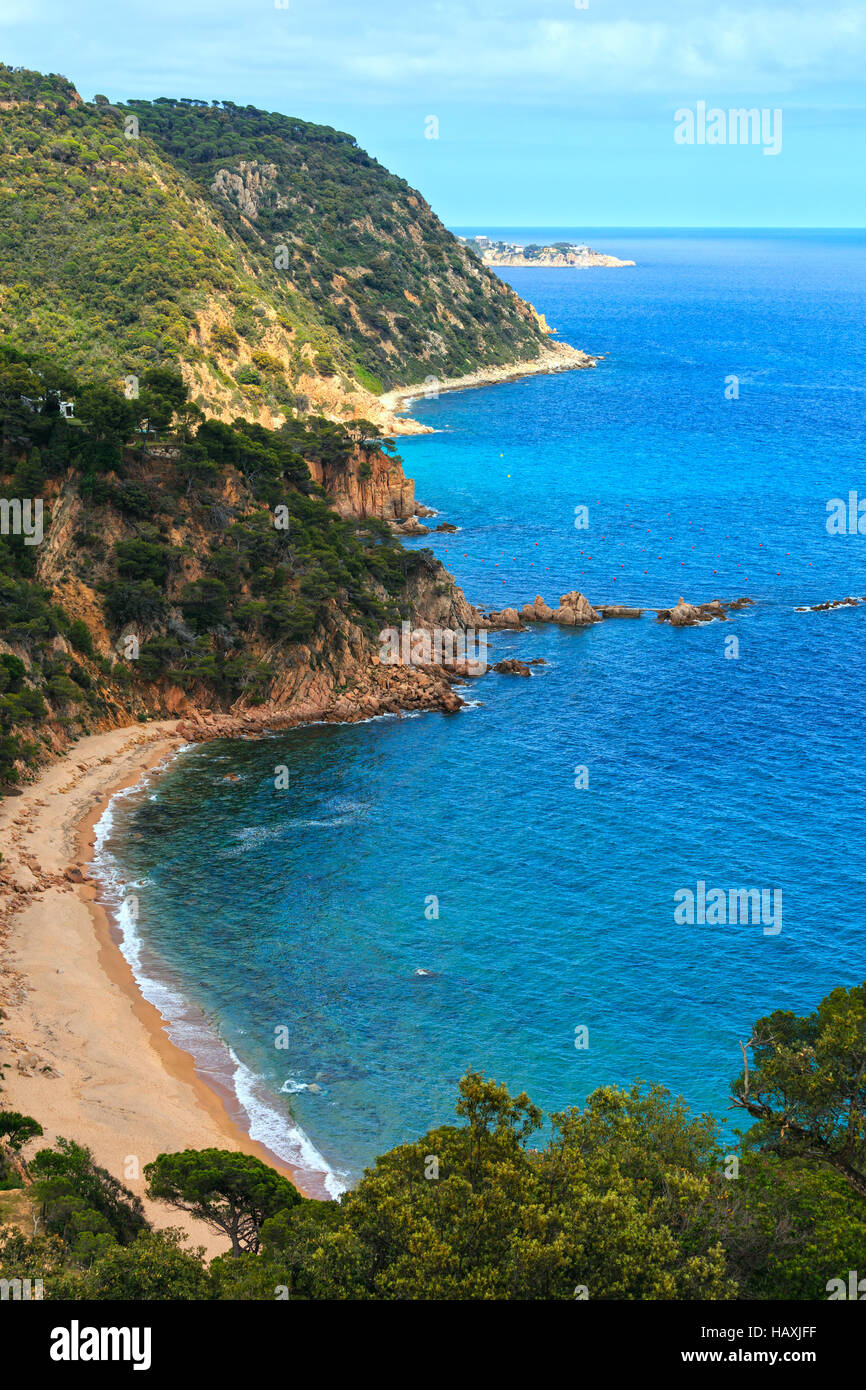 Summer sea rocky coast view with sandy Beach Cala del Senyor Ramon ...