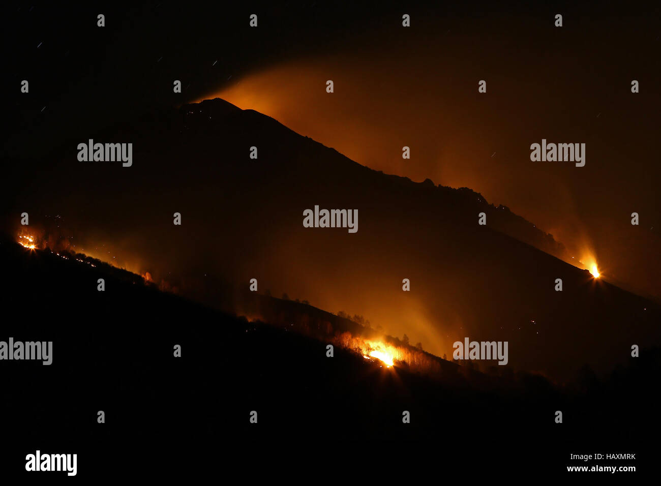 Forest fires spreading through mountains above Isone, in Switzerland ...