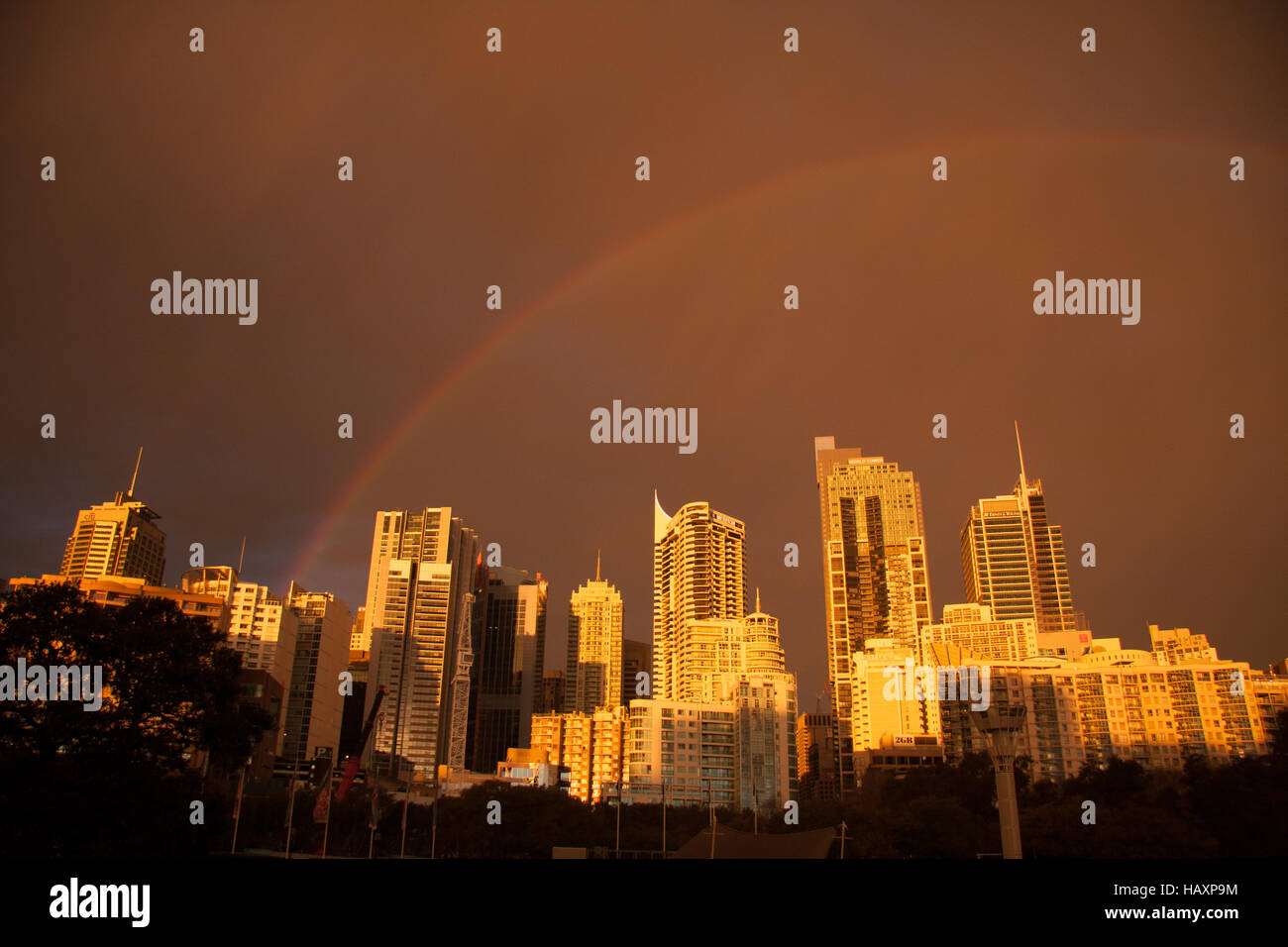 Rainbow over city in Sydney Stock Photo - Alamy