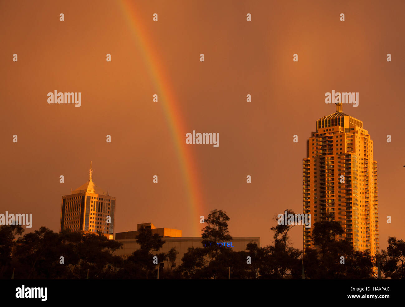 Rainbow over city in Sydney Stock Photo - Alamy