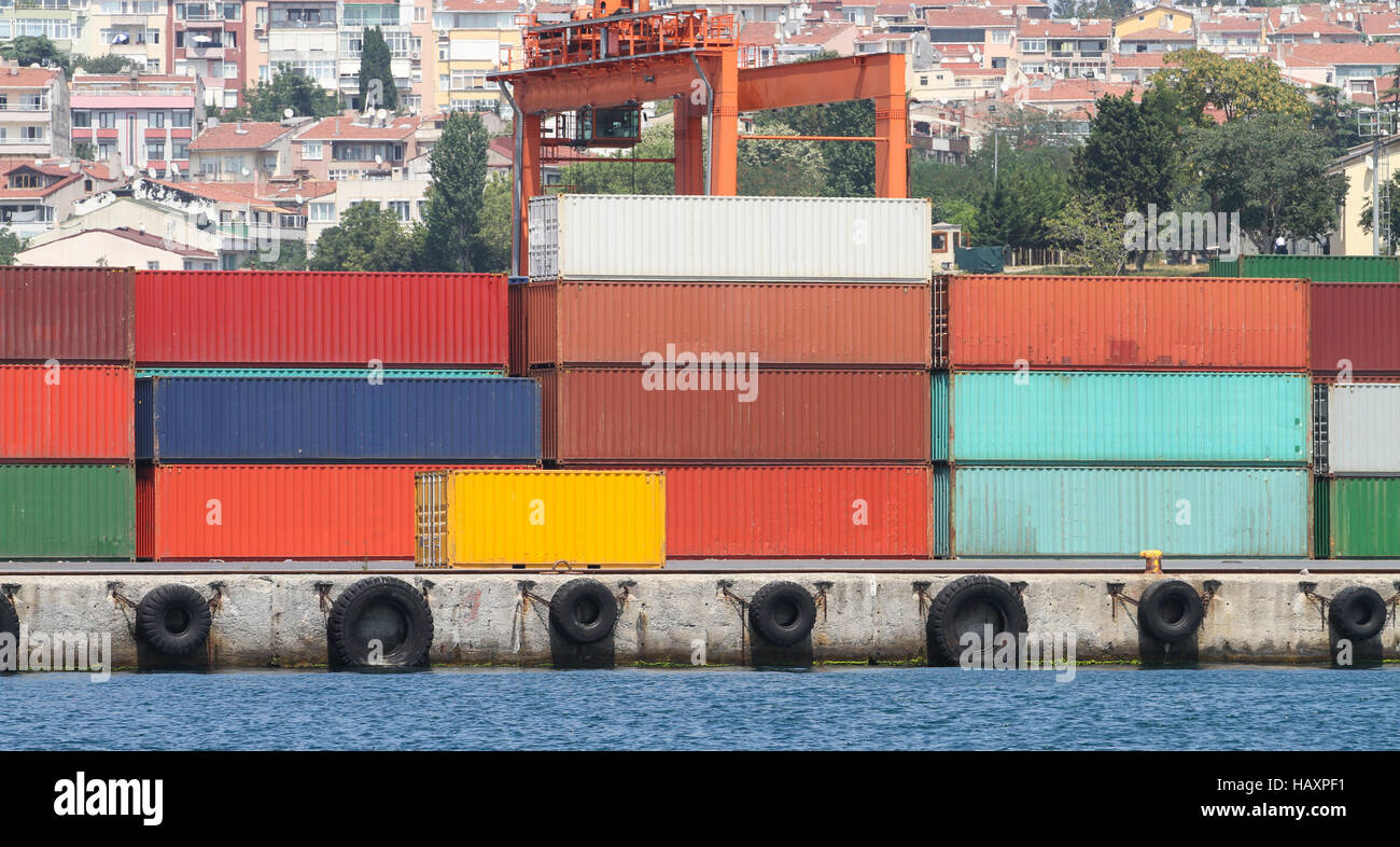Containers waiting to transfer in a port Stock Photo - Alamy