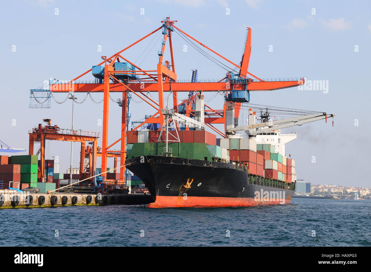 Container Ship is loading in a port Stock Photo - Alamy