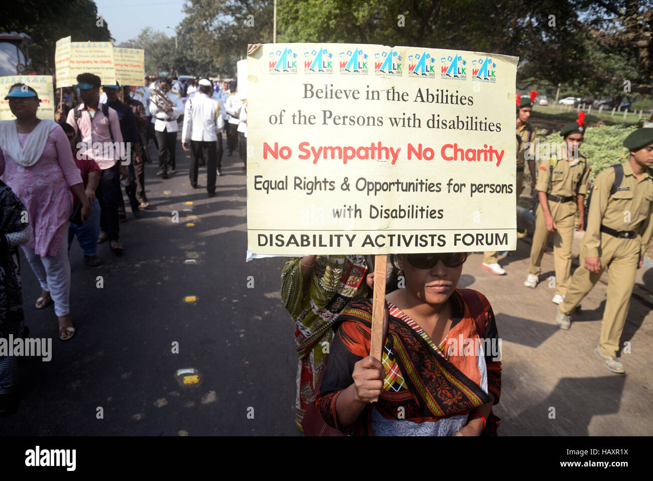 Kolkata, India. 03rd Dec, 2016. Disable person holds placard with ...