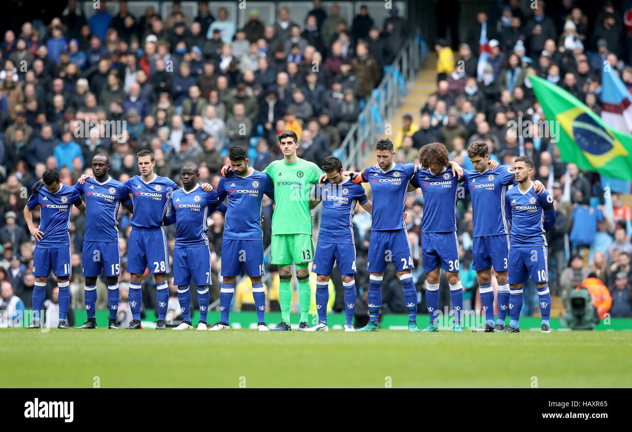 Chelsea players stand for a minute's silence for the Colombia plane ...