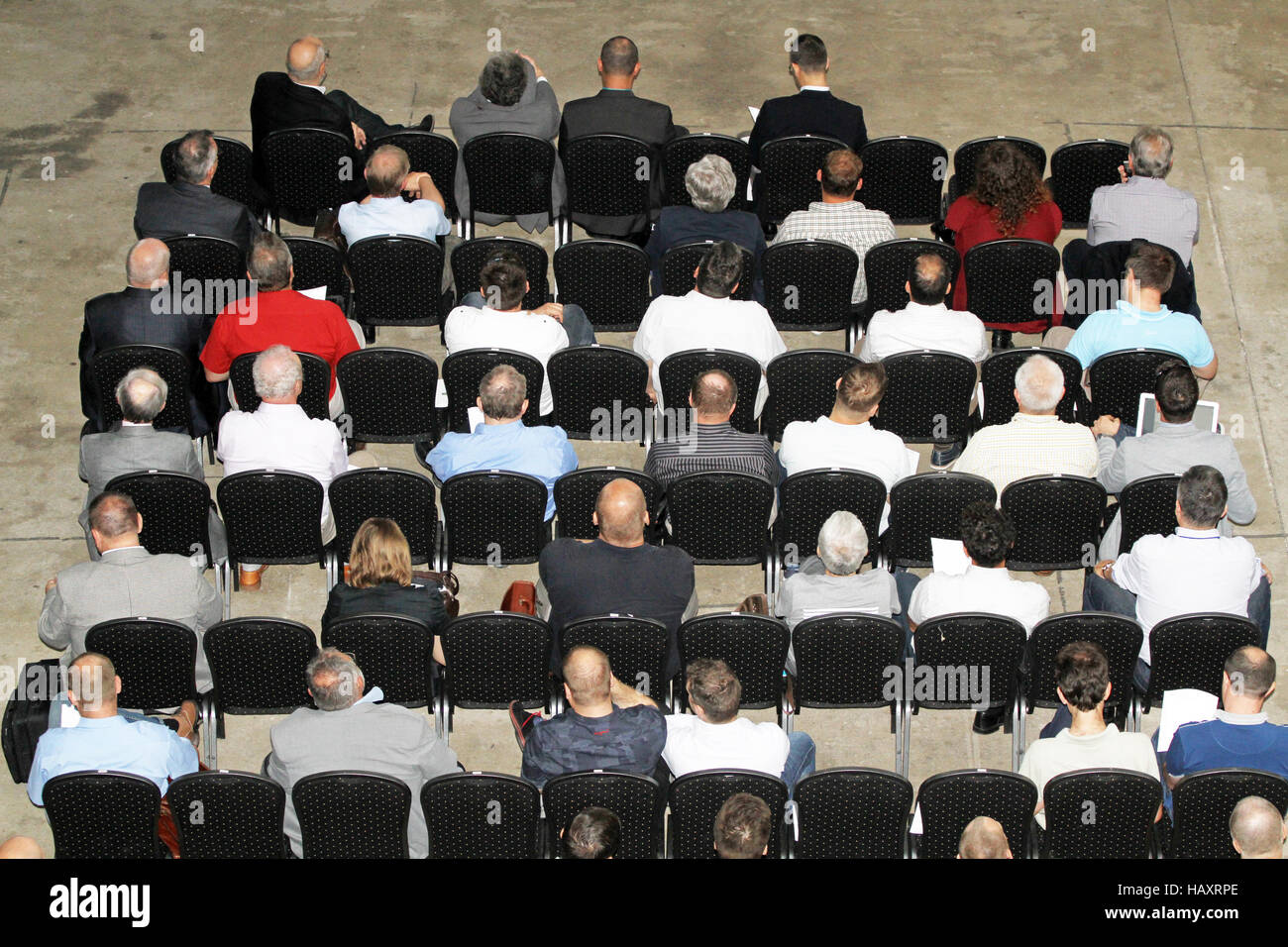 Group of unknown business people sitting and listening on scientical ...
