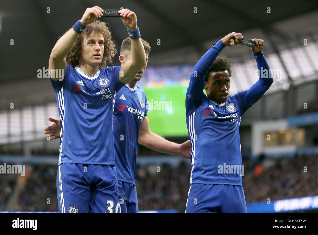 Chelsea's David Luiz (left) and Willian (right) display their arm bands ...