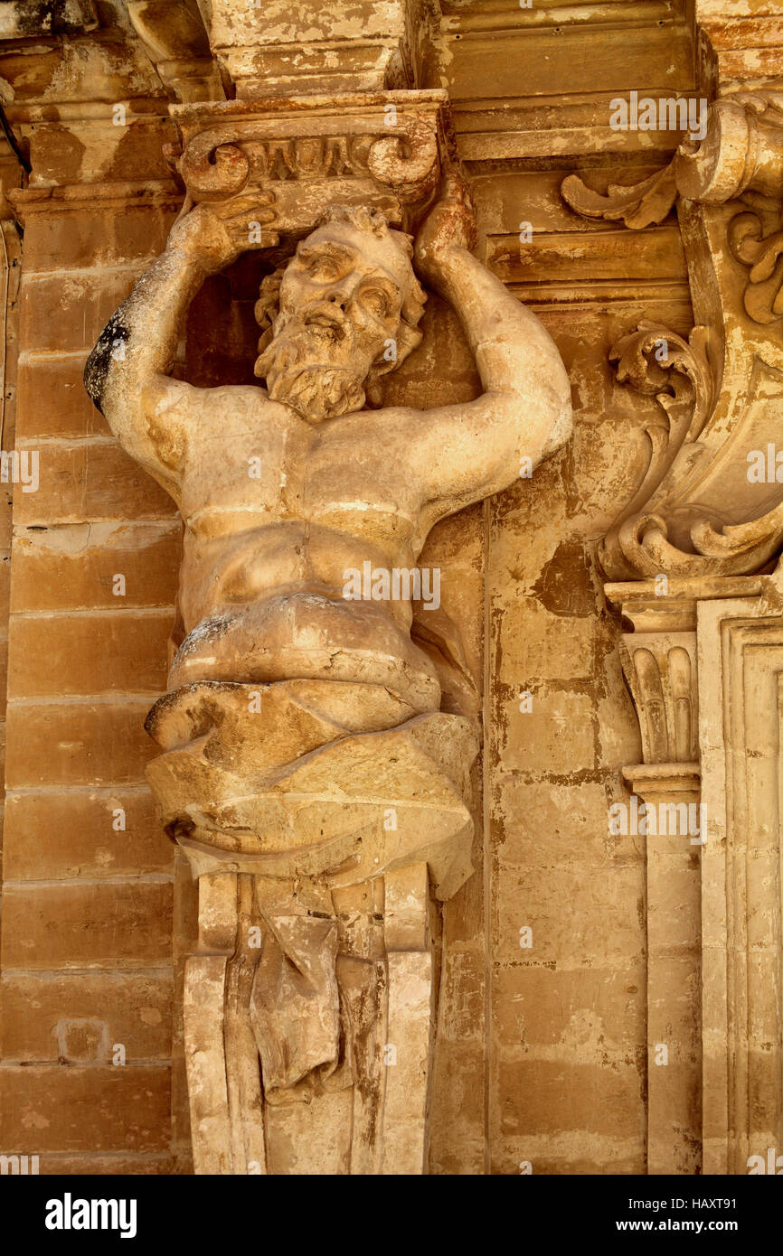 Upright picture of a carving of the figure of a man with bare chest as ...