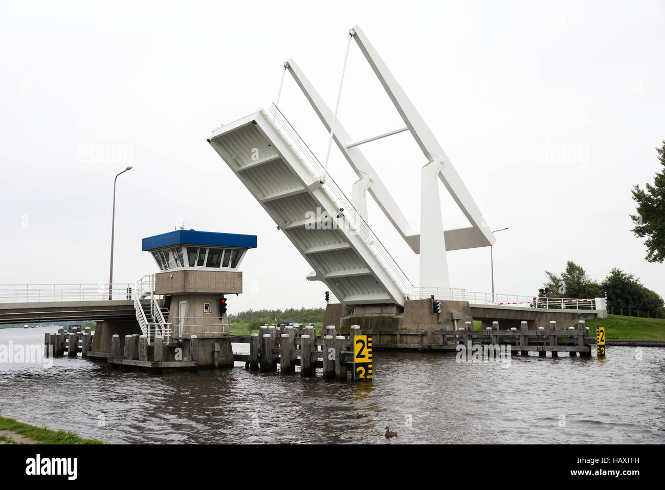 drawbridge in Friesland closing for the boats Stock Photo - Alamy