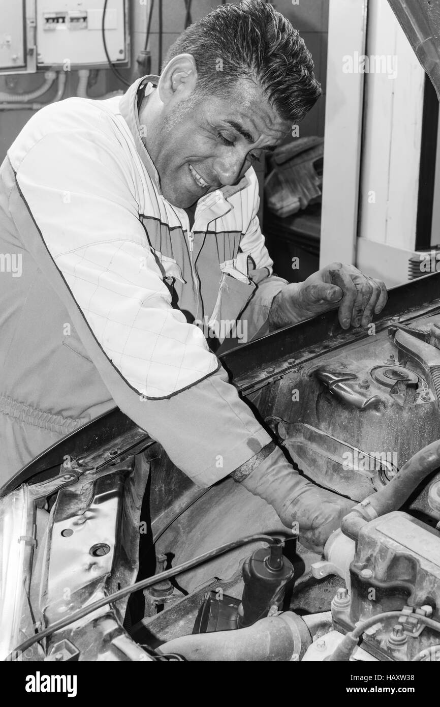 People in car garage Black and White Stock Photos & Images - Alamy