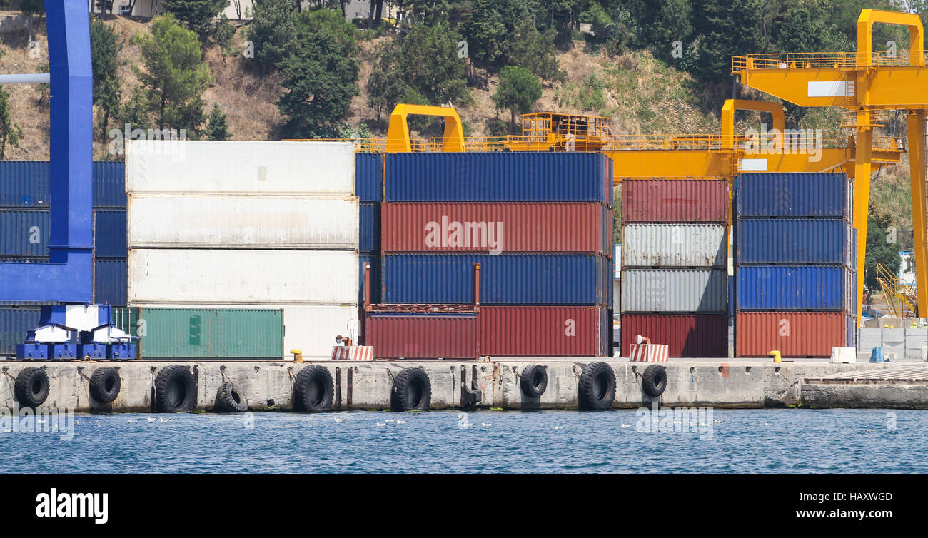 Containers waiting to transfer in a port Stock Photo - Alamy