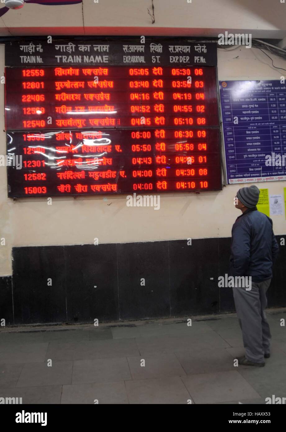 Allahabad, India. 03rd Dec, 2016. A passenger watch the time table ...