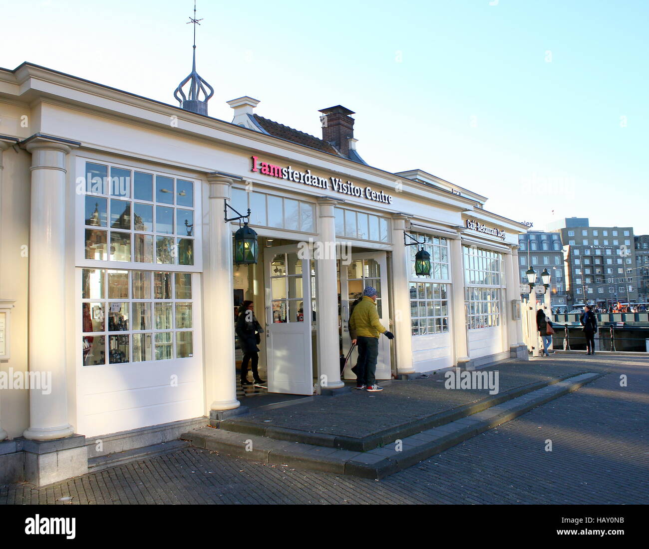 Tourist leaving Amsterdam Tourist Office / Visitor Centre on ...