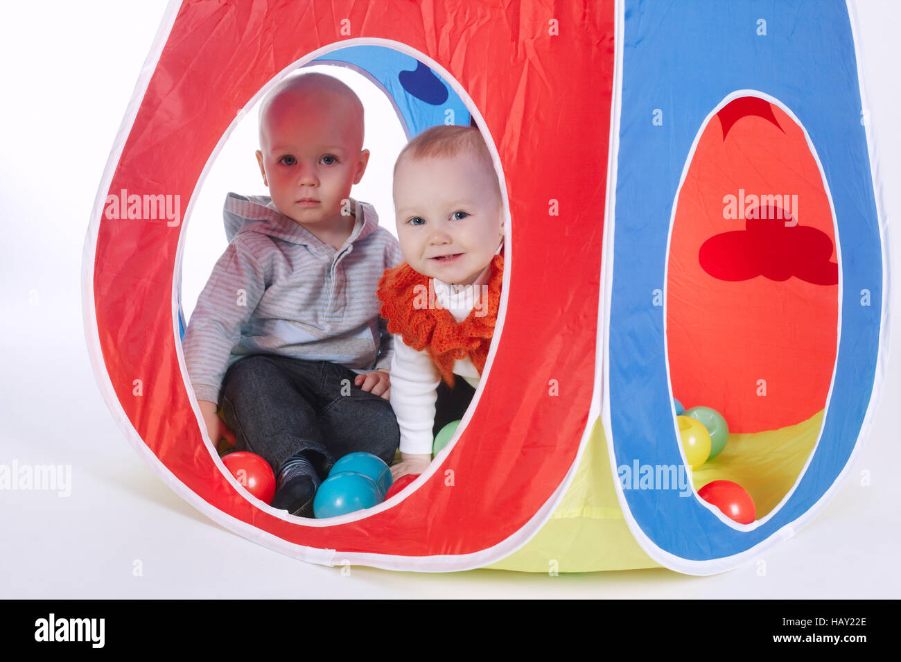 Little funny girl and boy in tent Stock Photo - Alamy
