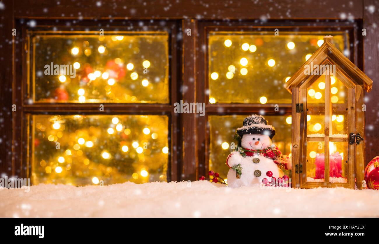 Atmospheric Christmas window sill with decoration and blur tree wth ...