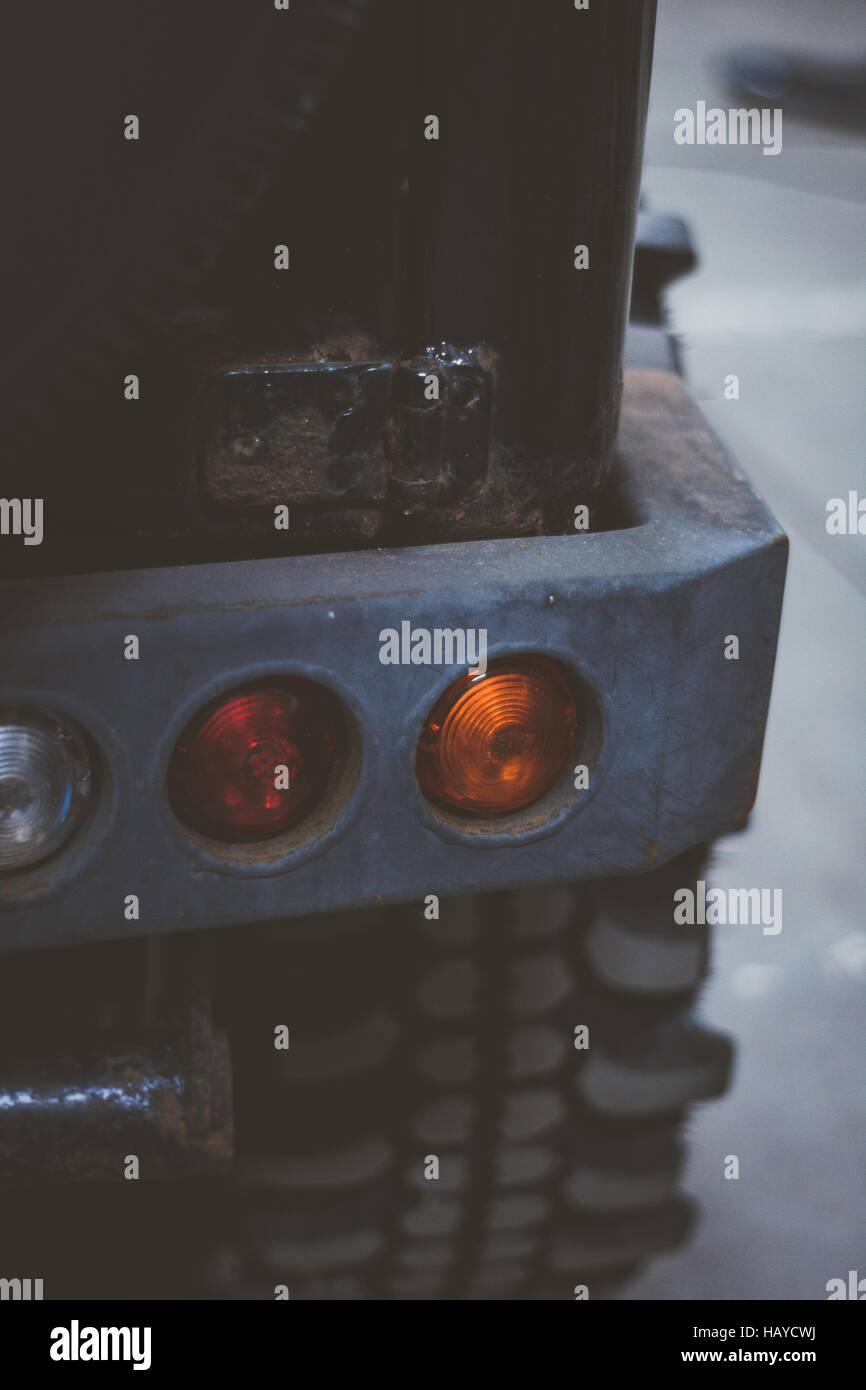 Vertical photo of 4x4 car rusty tail light Stock Photo - Alamy