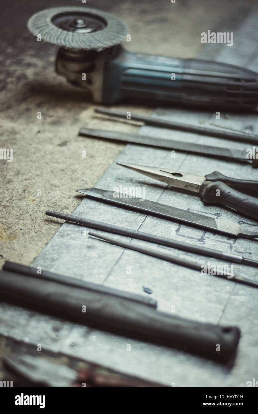 Auto mechanic metal parts and tools on a table Stock Photo - Alamy