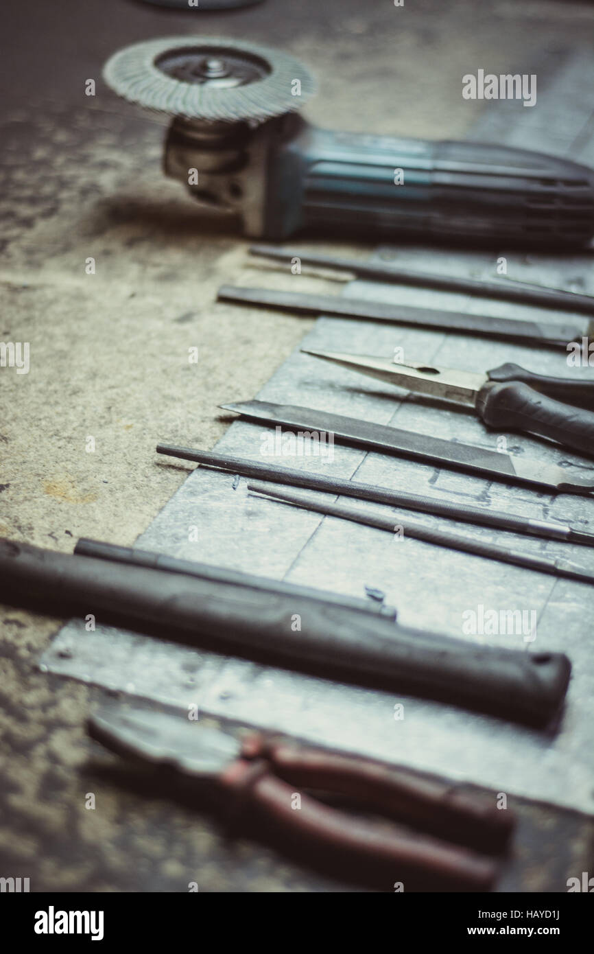 Auto mechanic metal parts and tools on a table Stock Photo - Alamy