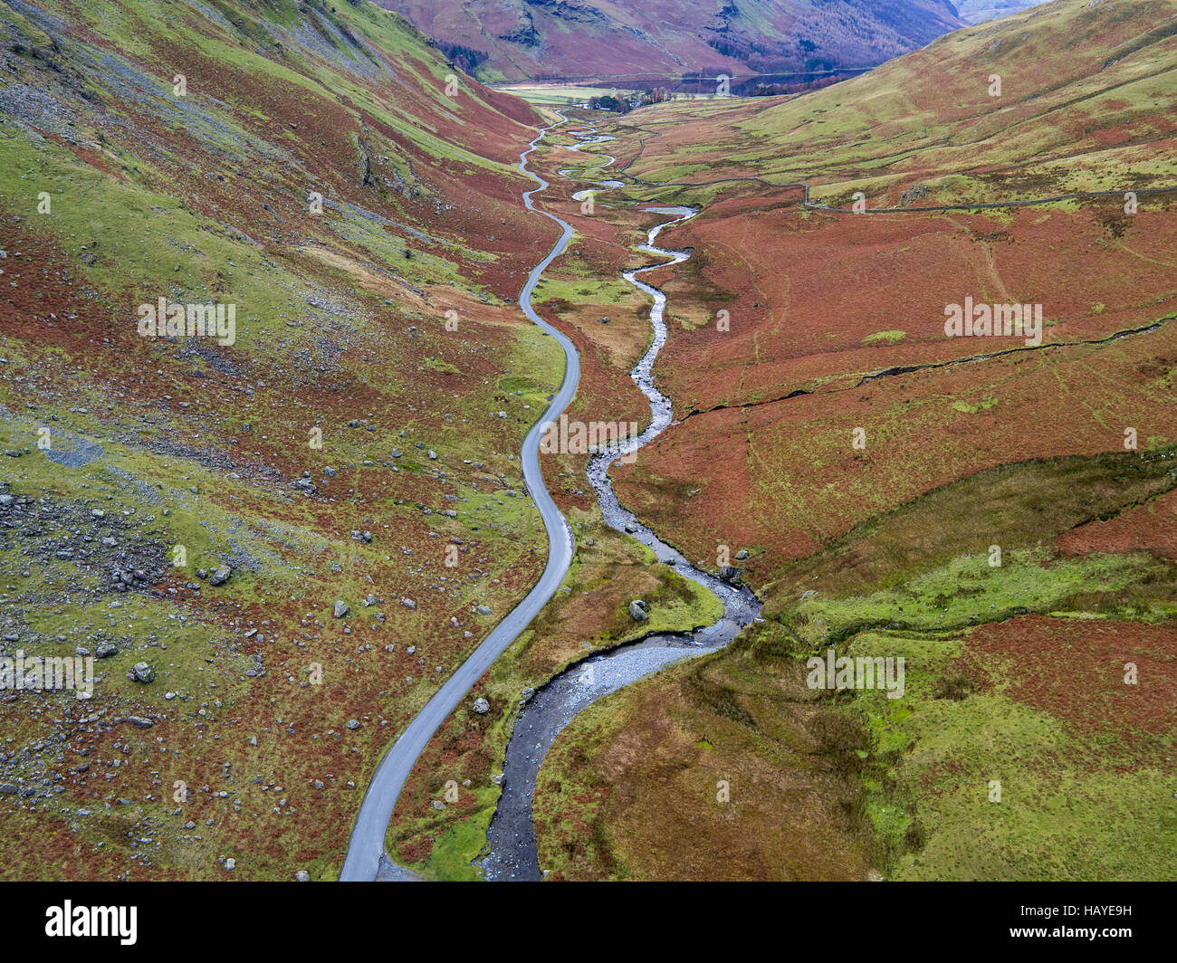 Aerial images of a road and river running through Honister Pass in The ...